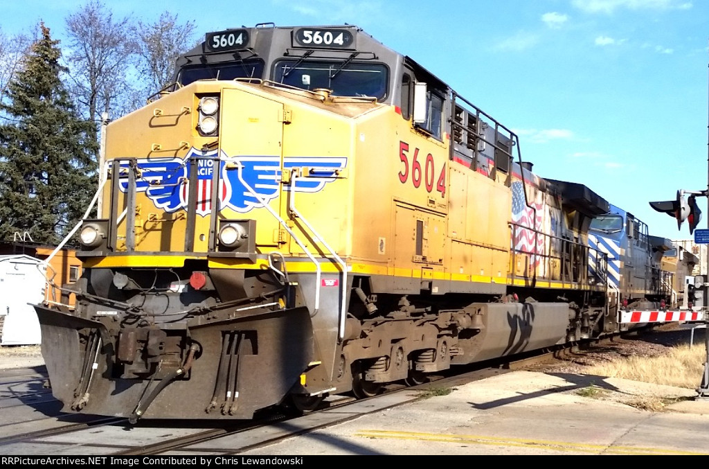 UP 5604, CEFX 1002, and UP 5290 Power A Slow Stacked Freight